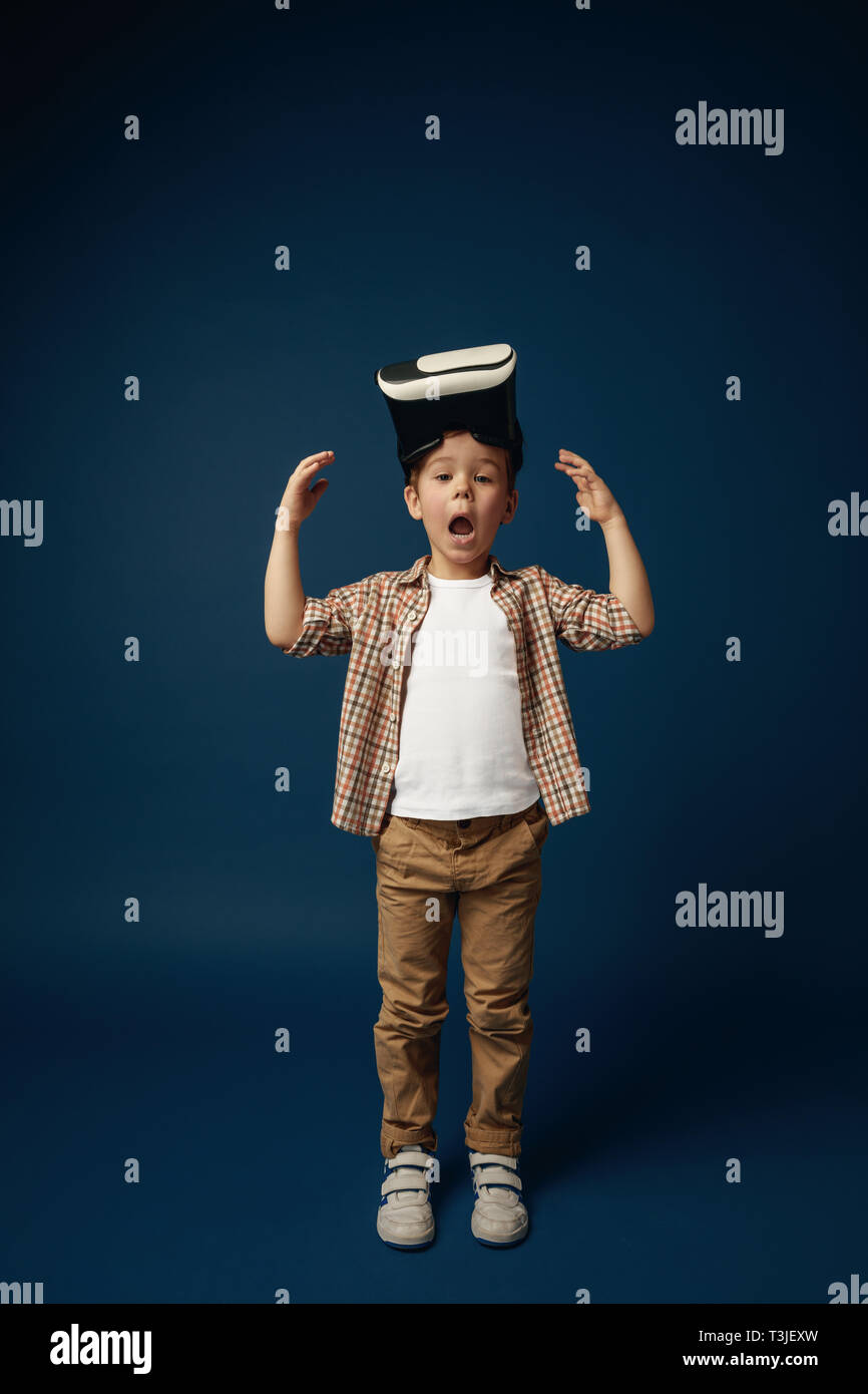 Young cosmonaut. Little boy or child in jeans and shirt with virtual ... Young cosmonaut. Little boy or child in jeans and shirt with virtual ...
