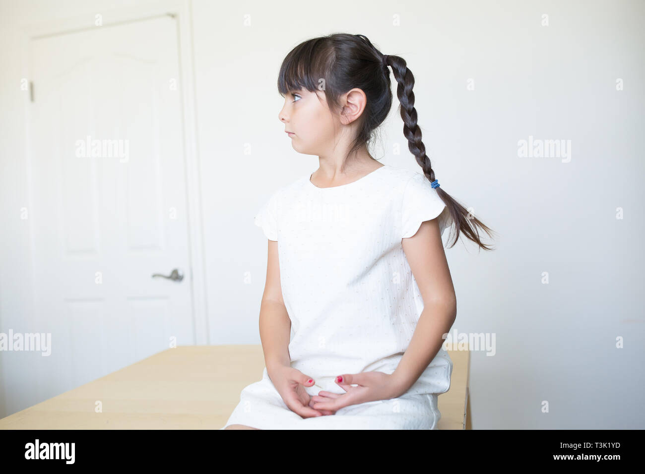 Kid turning her head sideways Stock Photo - Alamy