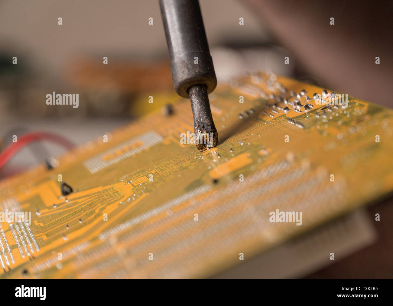 Human hand holding soldering iron hi-res stock photography and images - Alamy
