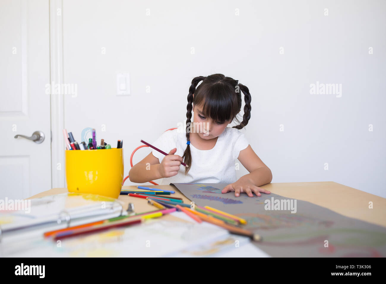 6-7 years old girl is coloring and drawing Stock Photo - Alamy
