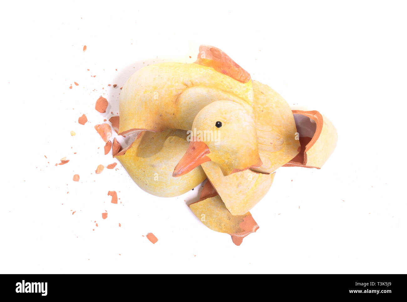 Broken statue of a duckling, isolated on white Stock Photo - Alamy