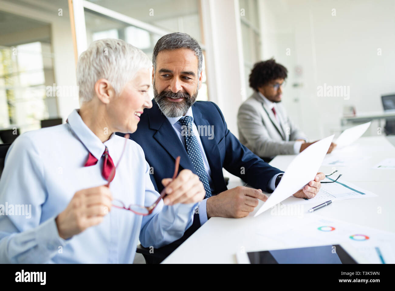 Successful company with happy workers in office Stock Photo - Alamy