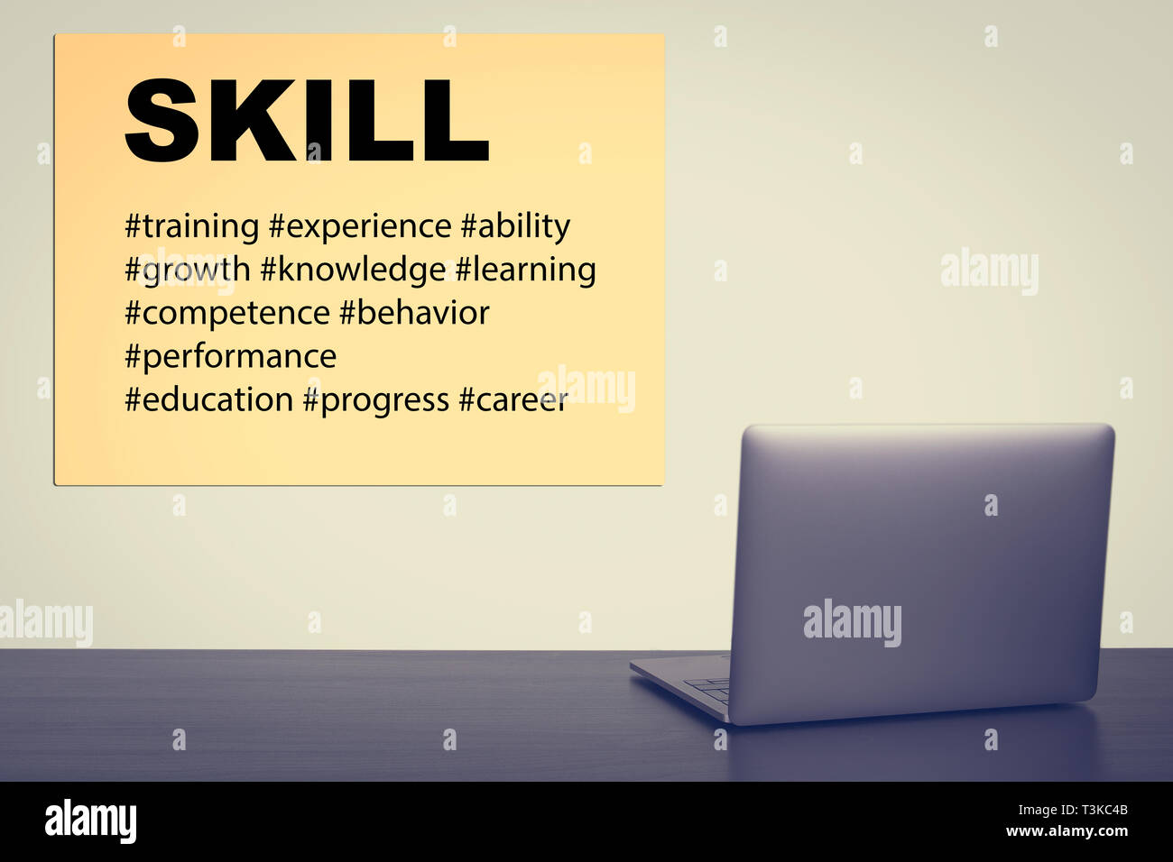 Skill concept. Laptop computer on a dark table Stock Photo - Alamy