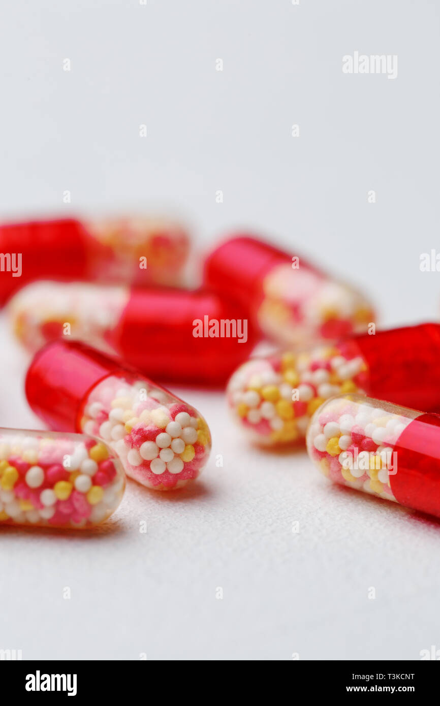 Pharmaceutical medicine capsules over white background Stock Photo - Alamy