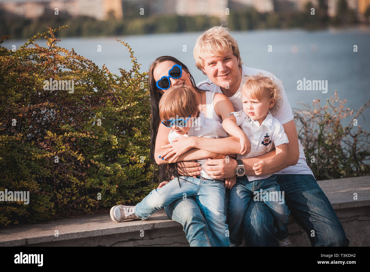 Happy family together against beautiful background Stock Photo - Alamy