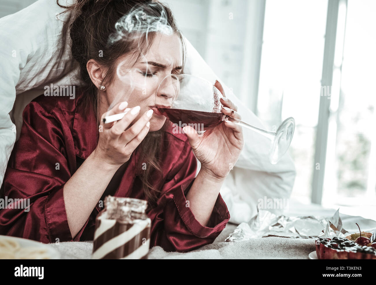 Crying woman with cigarette hi-res stock photography and images - Alamy