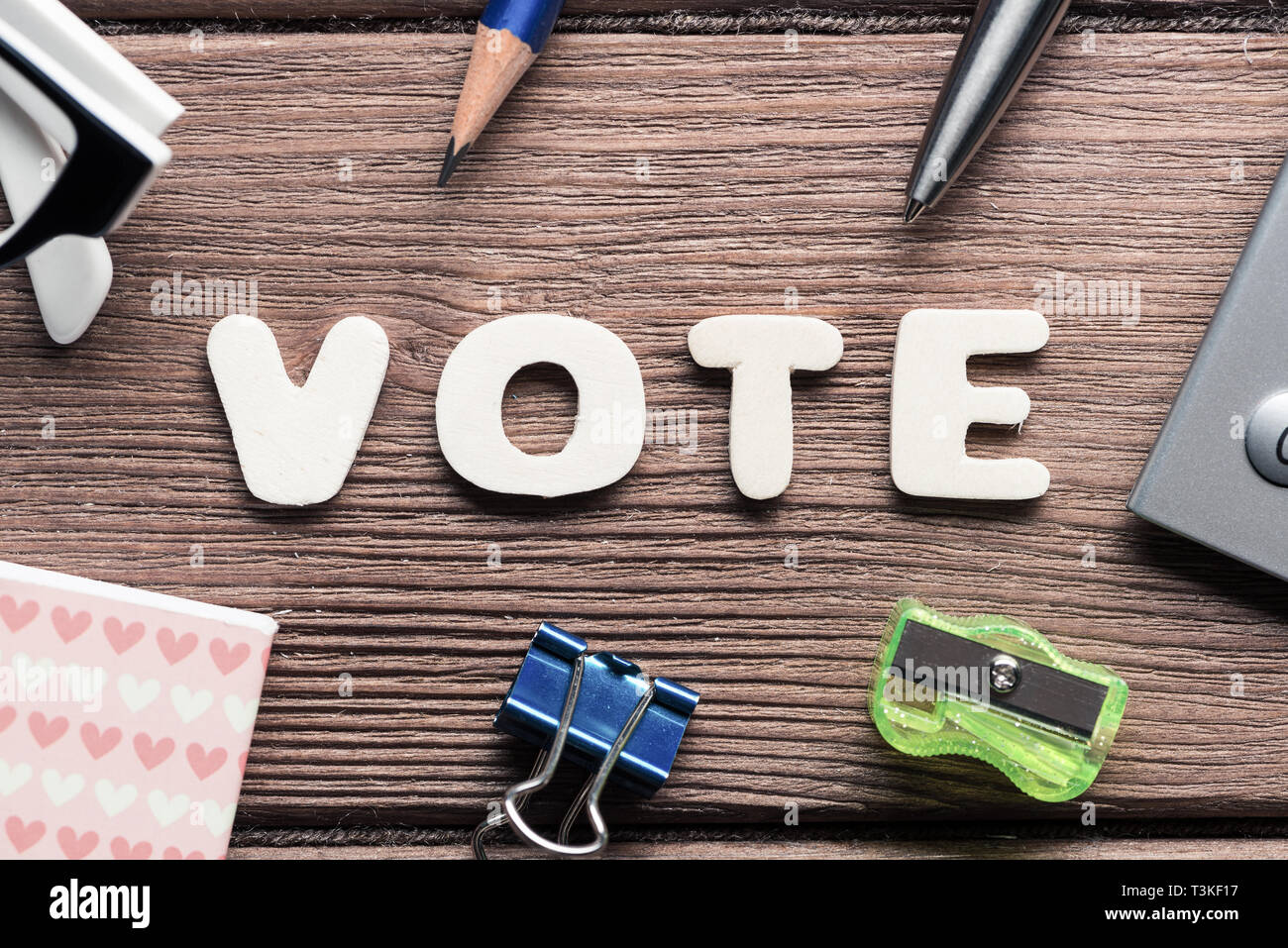 Vote word on wooden table and office stationary around Stock Photo - Alamy