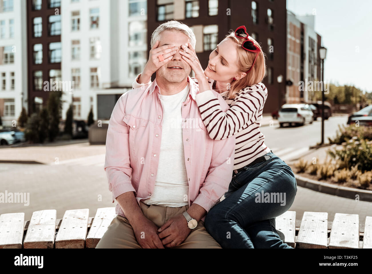 Woman covering husbands eyes hi-res stock photography and images - Alamy