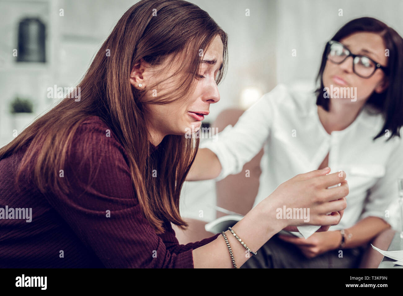 Emotional young woman crying speaking about her ex boyfriend Stock ...