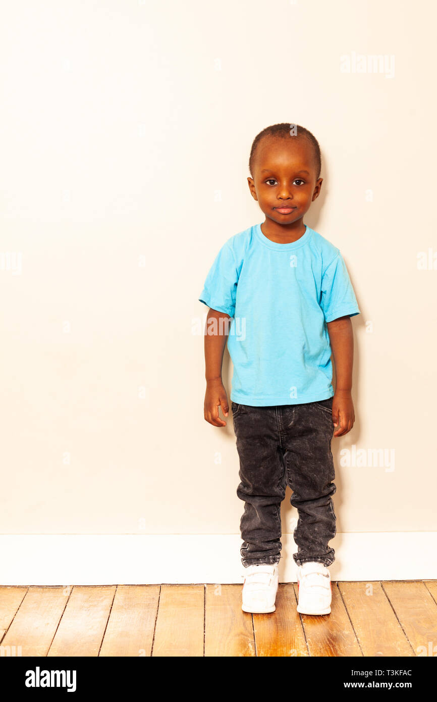 Full height portrait of little black boy smiling Stock Photo - Alamy