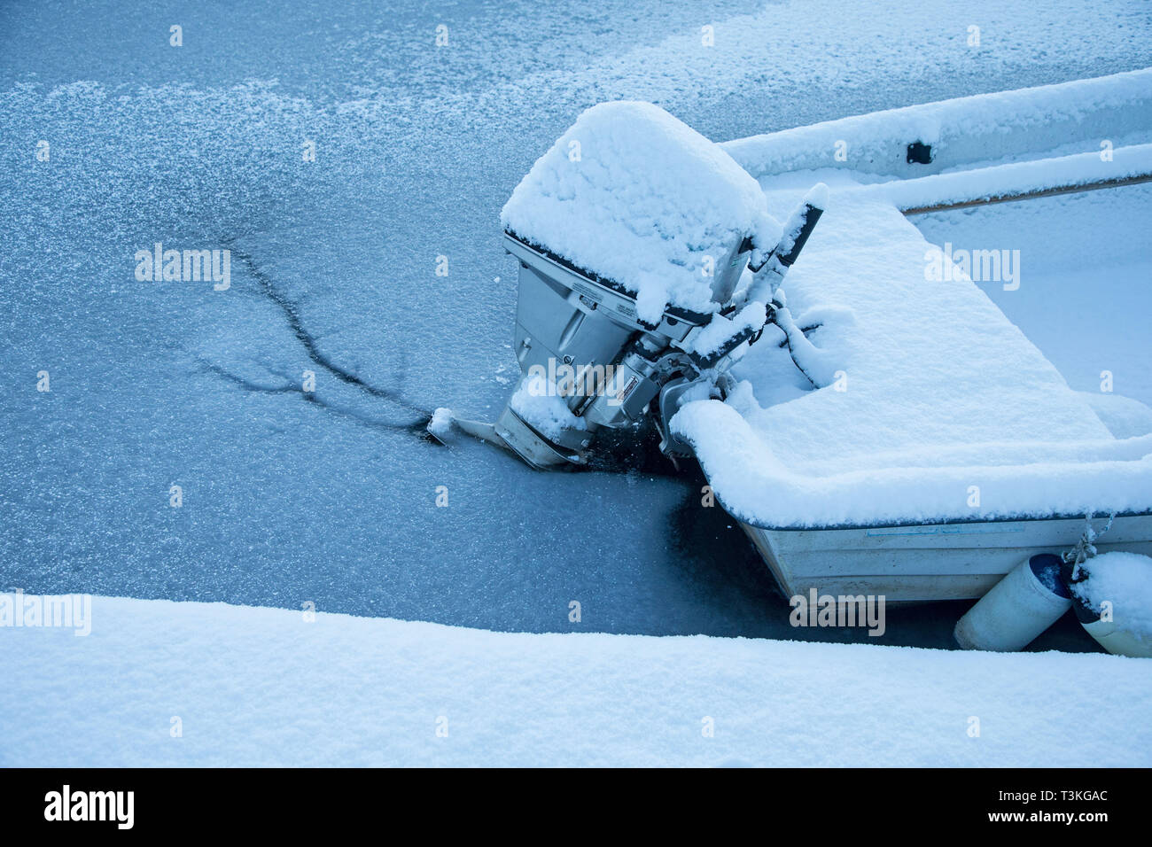 Boat, with engine, frozen in the ice Stock Photo - Alamy