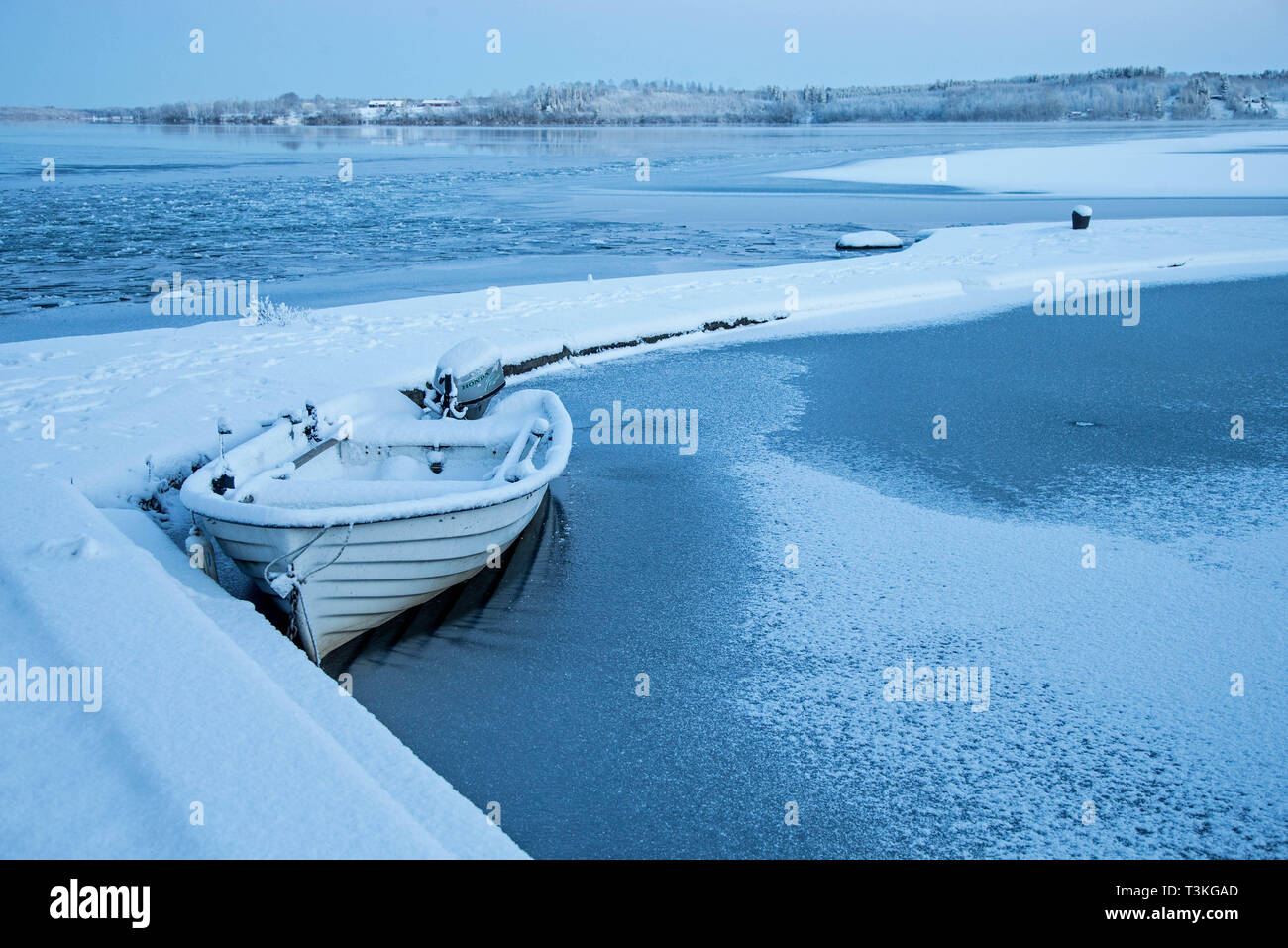 Boat, with engine, frozen in the ice Stock Photo - Alamy