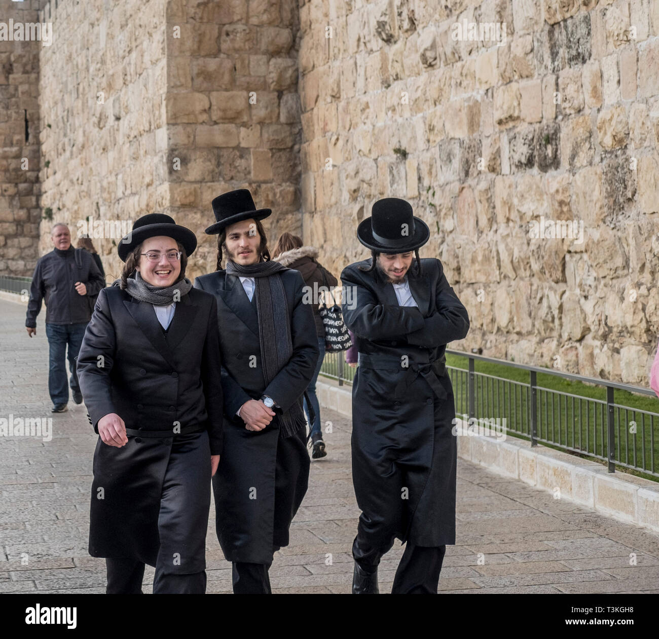 A group of happy Orthodox Jews walk towards Jaffa Gate in Jerusalem ...