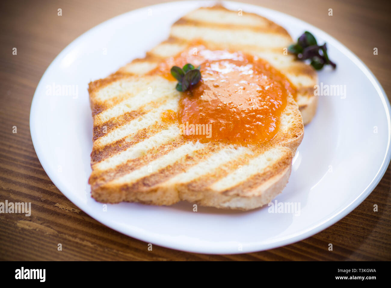 fried toast with apricot jam in a plate Stock Photo - Alamy
