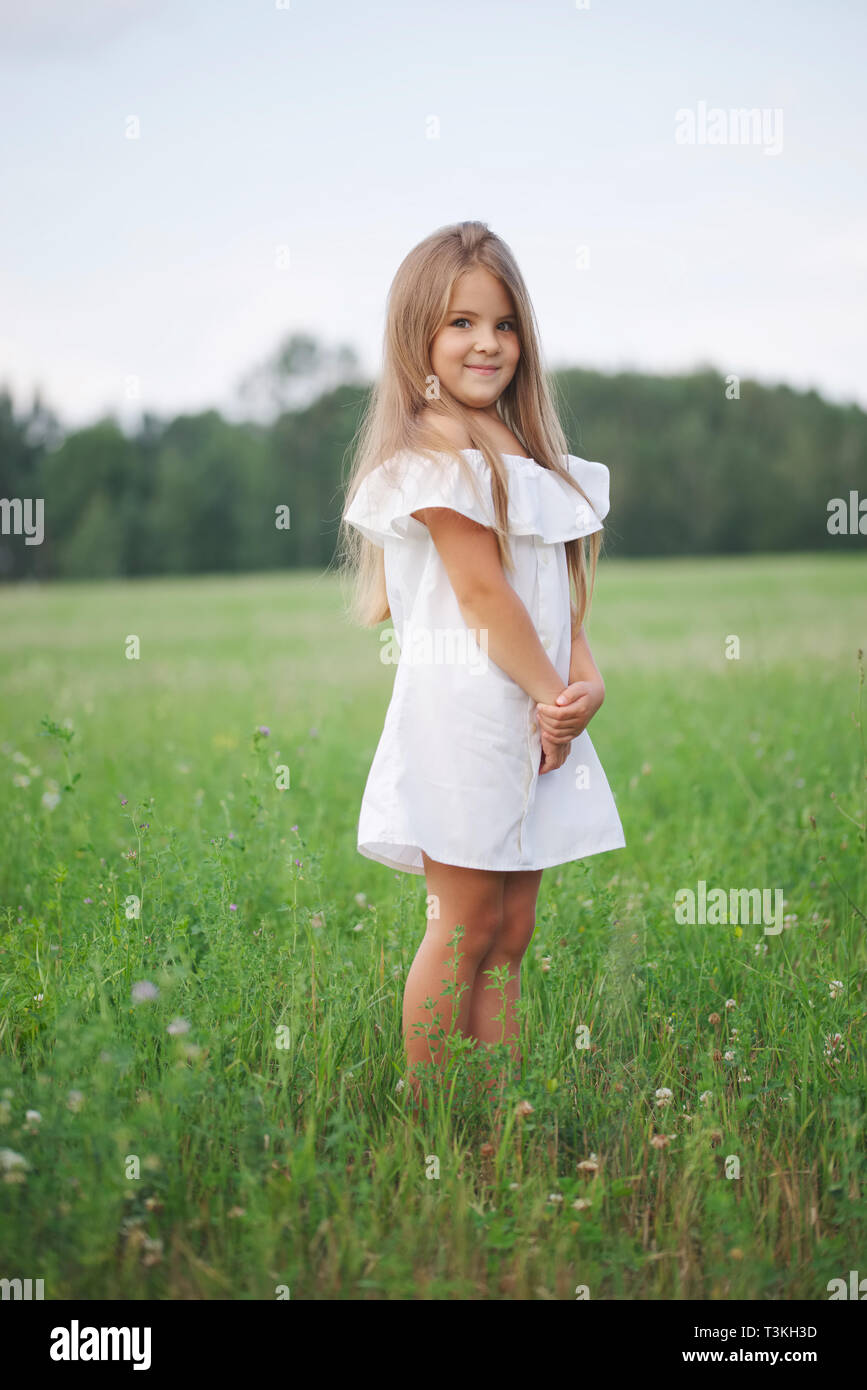 happy little girl with long hair Stock Photo - Alamy