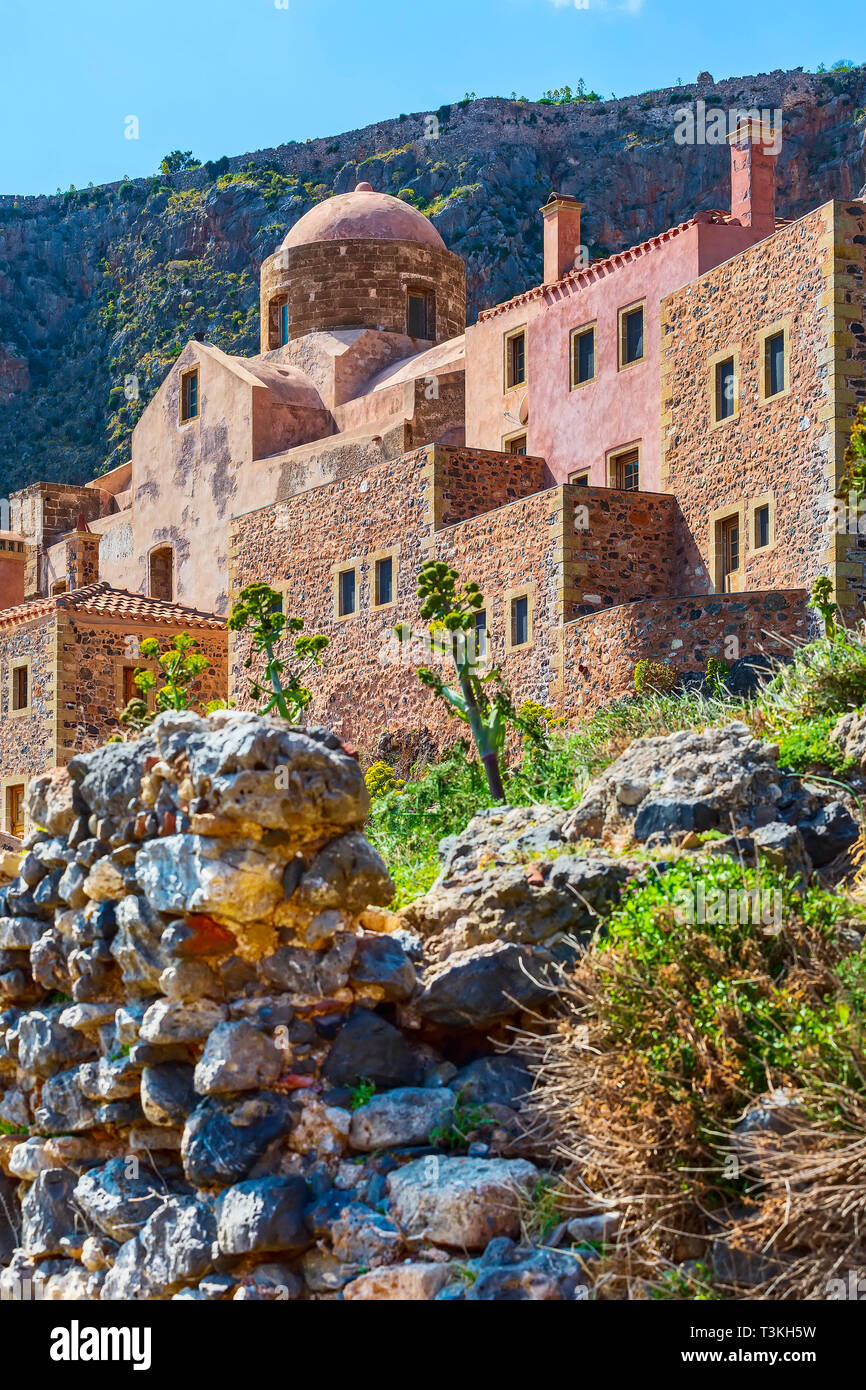 Monemvasia street view with old houses and church dome in ancient town ...