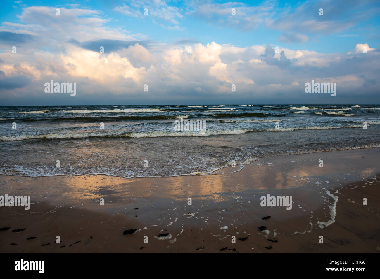 empty sea beach before storm with dramatic clouds and shadows from ...