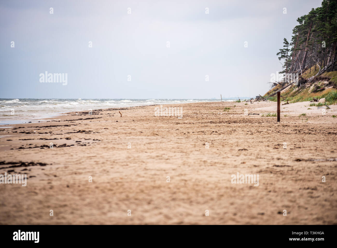 empty sea beach before storm with dramatic clouds and shadows from ...