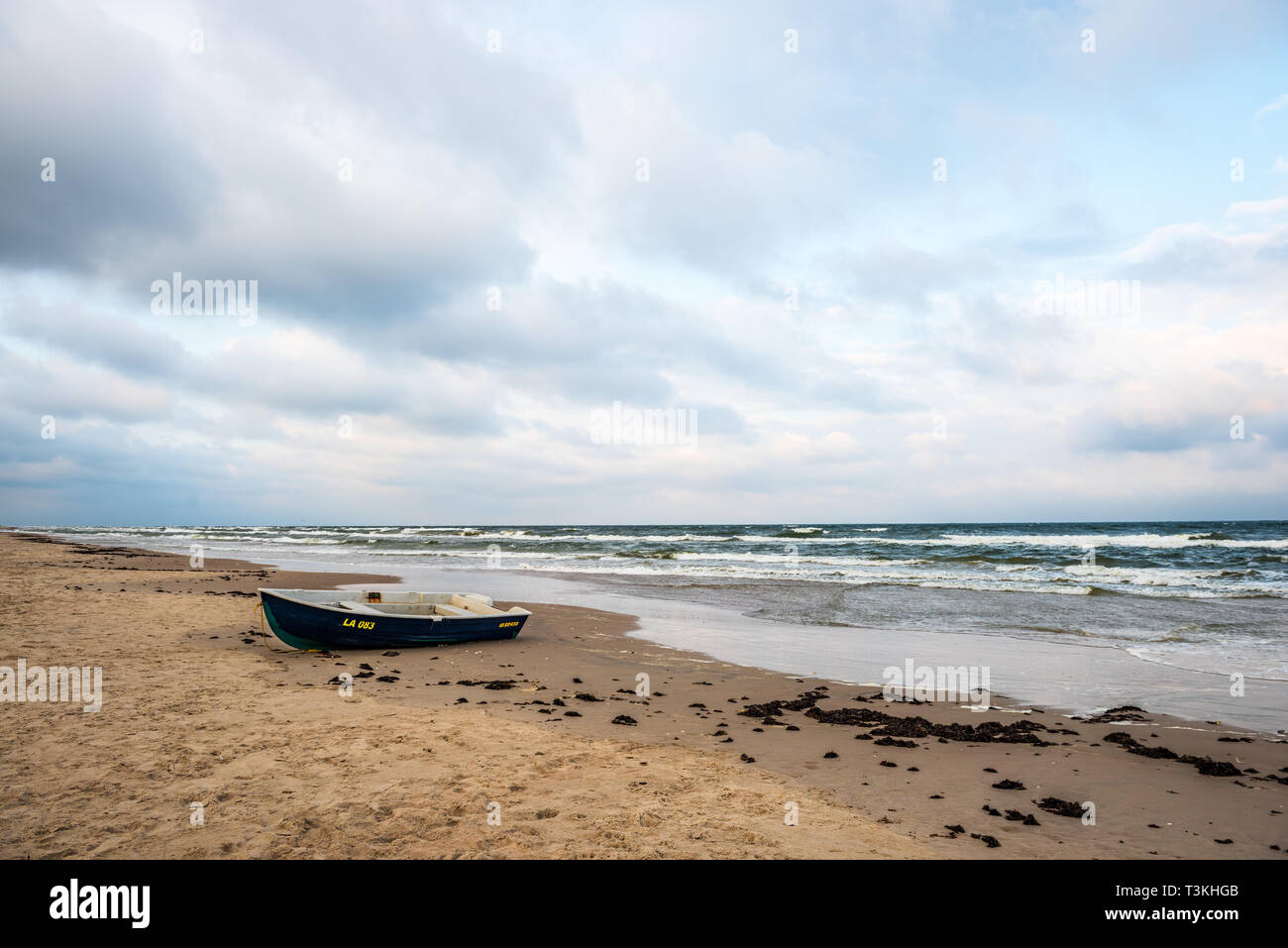 empty sea beach before storm with dramatic clouds and shadows from ...