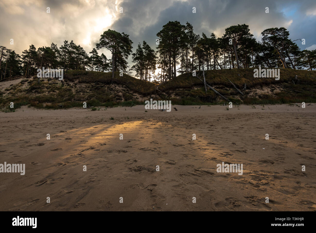 empty sea beach before storm with dramatic clouds and shadows from ...