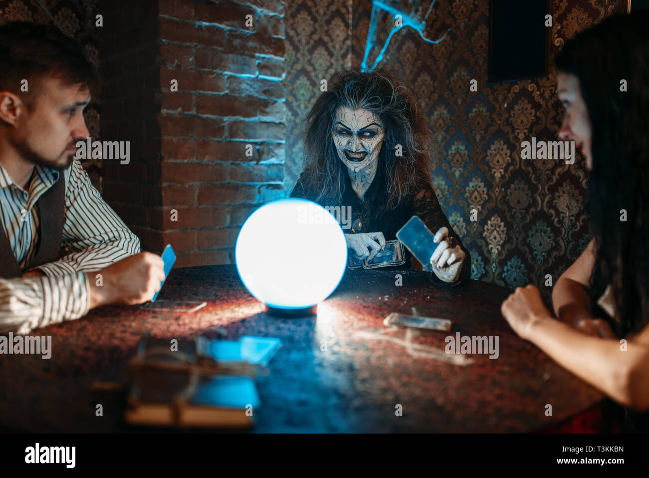 Witch reads a magic spell over a crystal ball Stock Photo - Alamy