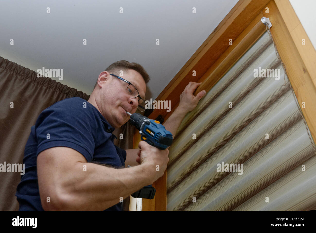 Window blinds installation Stock Photo - Alamy