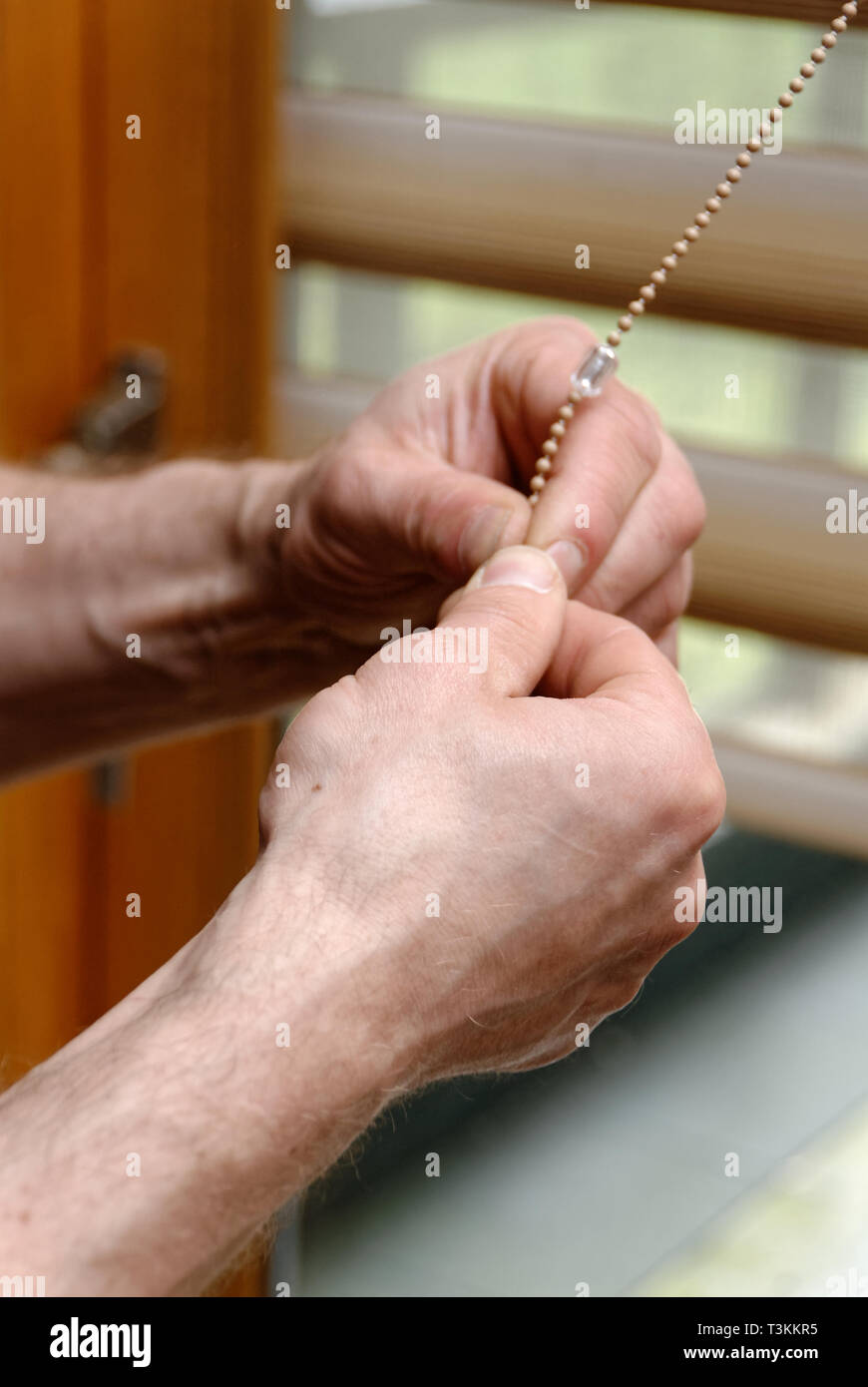 Window blinds installation Stock Photo - Alamy