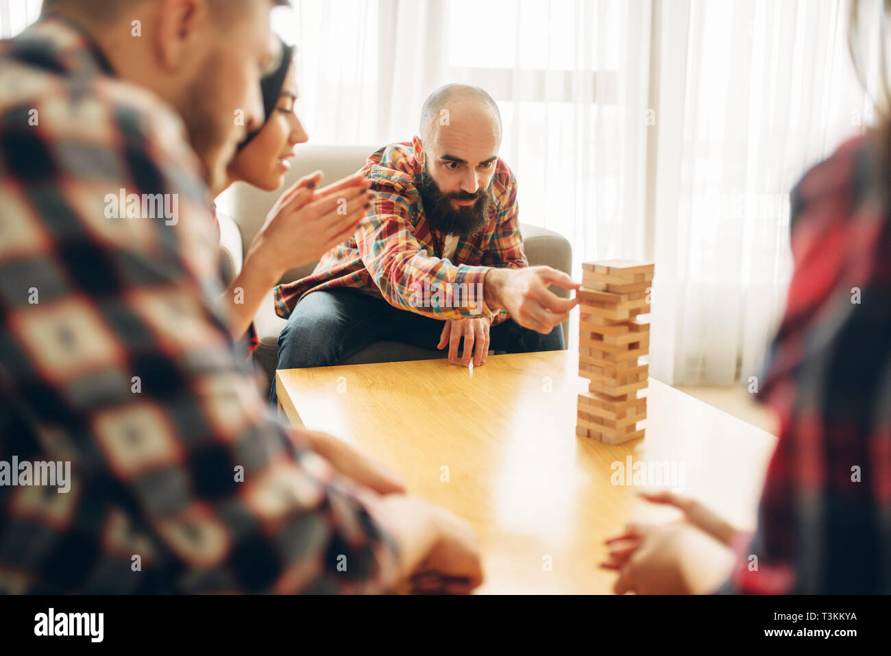 Man playing jenga wooden block hi-res stock photography and images - Alamy
