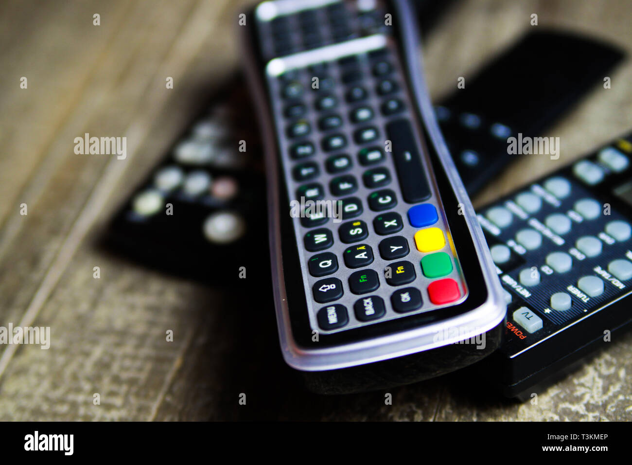 Close up of remote controls for TV, Video and stereo music system on ...