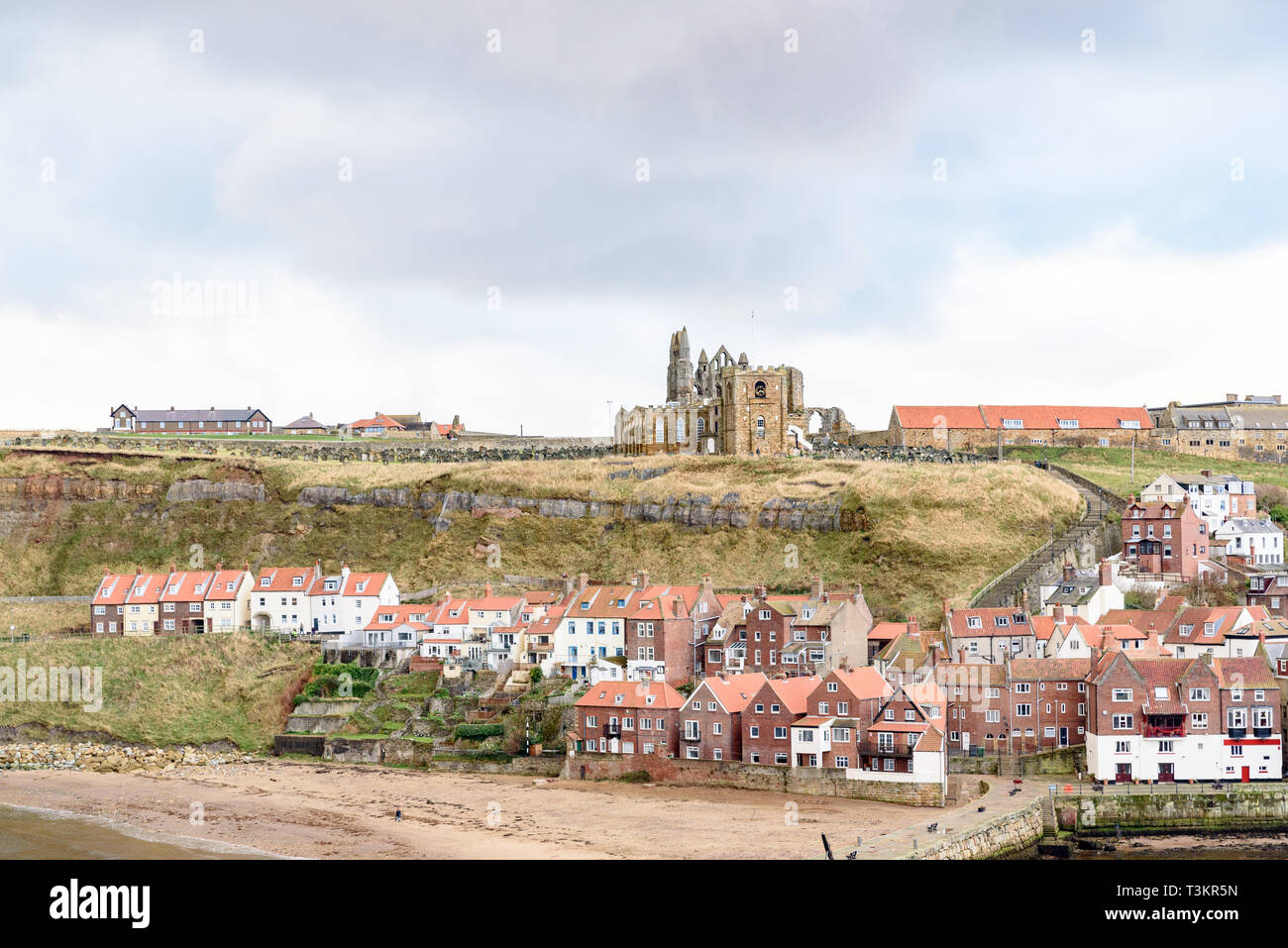 Whitby Abbey across the harbour, with a cloudy sky Stock Photo - Alamy