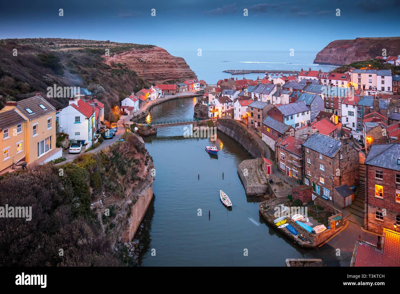 A classic view of Staithes at dusk & high tide, Staithes is a a ...