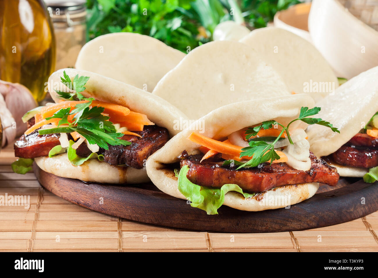 Gua bao, steamed buns with pork belly and vegetable. Asian cuisine ...