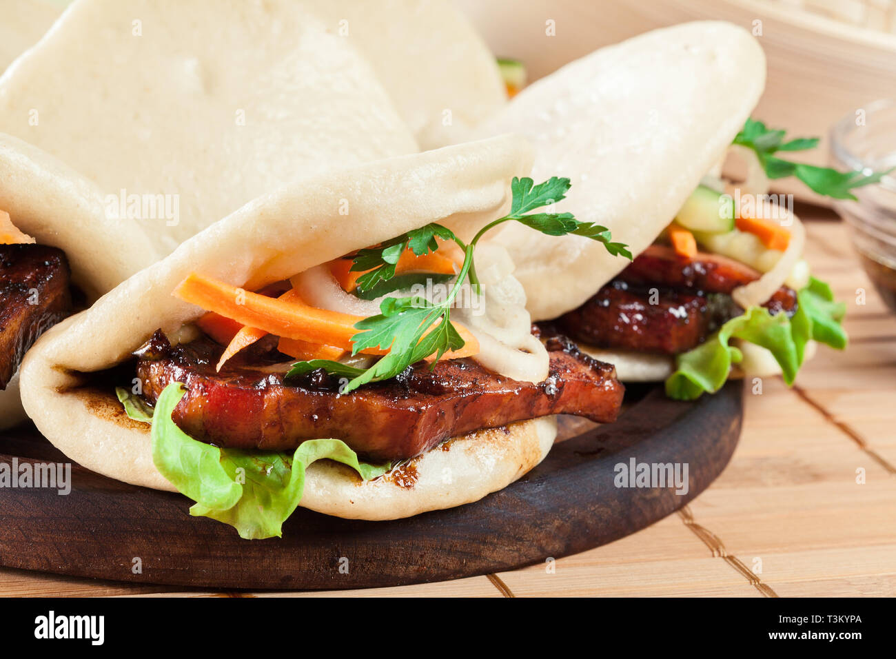 Gua bao, steamed buns with pork belly and vegetable. Asian cuisine ...
