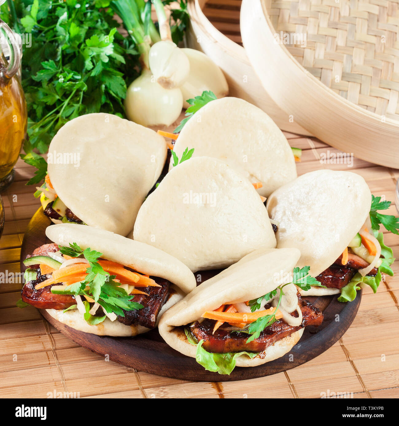 Gua bao, steamed buns with pork belly and vegetable. Asian cuisine ...