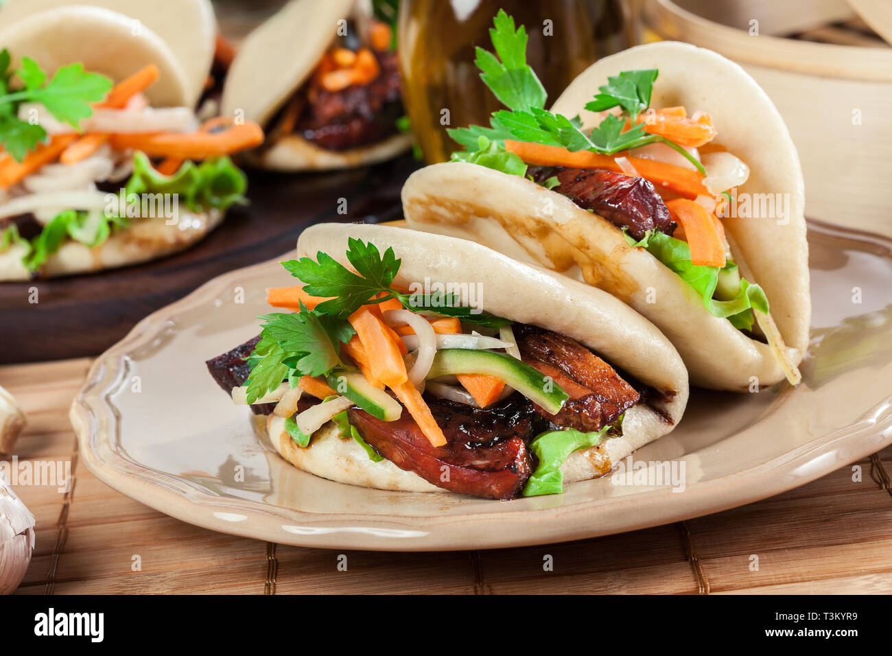 Gua bao, steamed buns with pork belly and vegetable. Asian cuisine ...