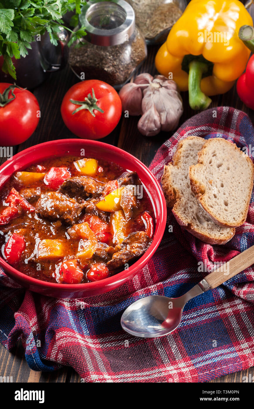 Traditional Hungarian beef goulash with red and yellow pepper Stock ...