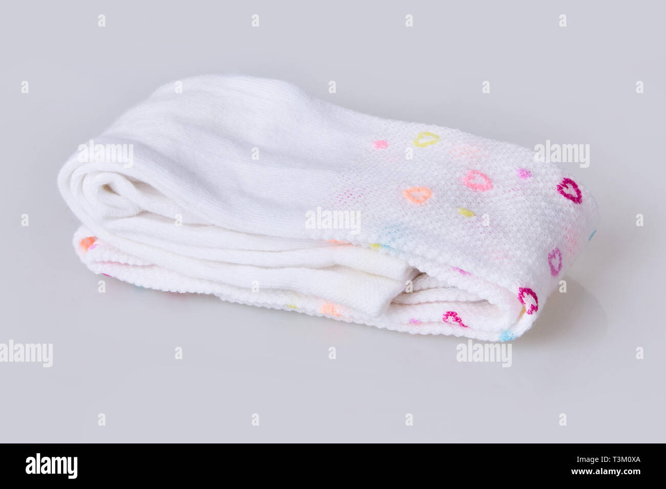 New hearts patterned folded child's tights isolated on white Stock ...