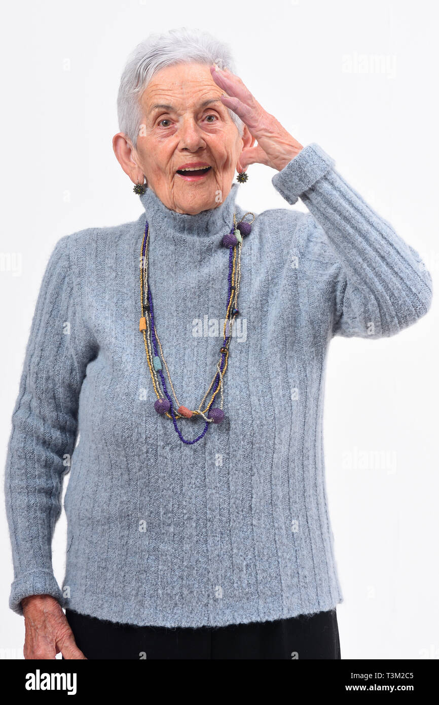 senior woman with expression of forgetfulness or surprise on white ...