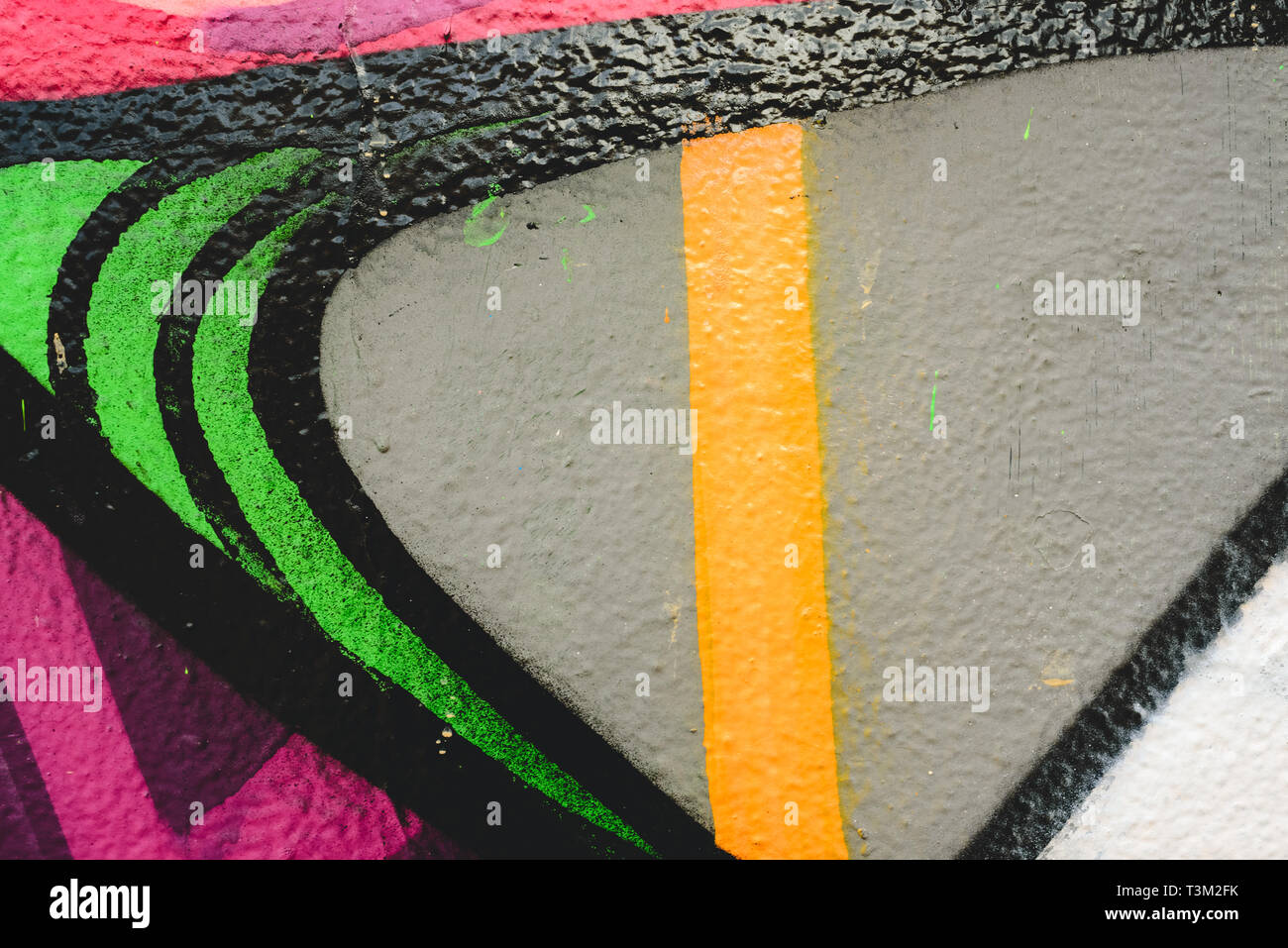 Detail of an anonymous street graffiti with many colors, cheerful urban ...