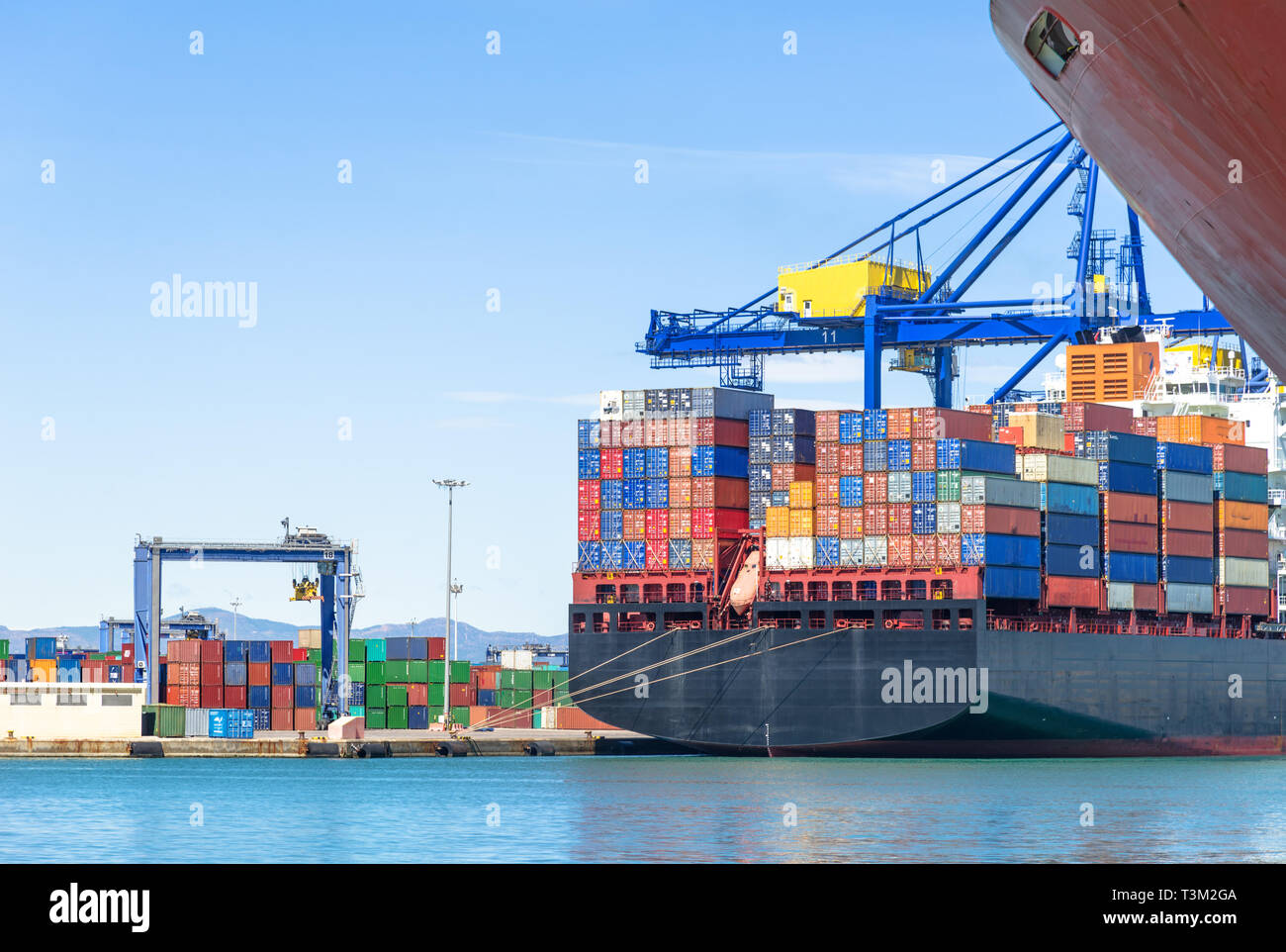 Container ship in harbor Stock Photo - Alamy