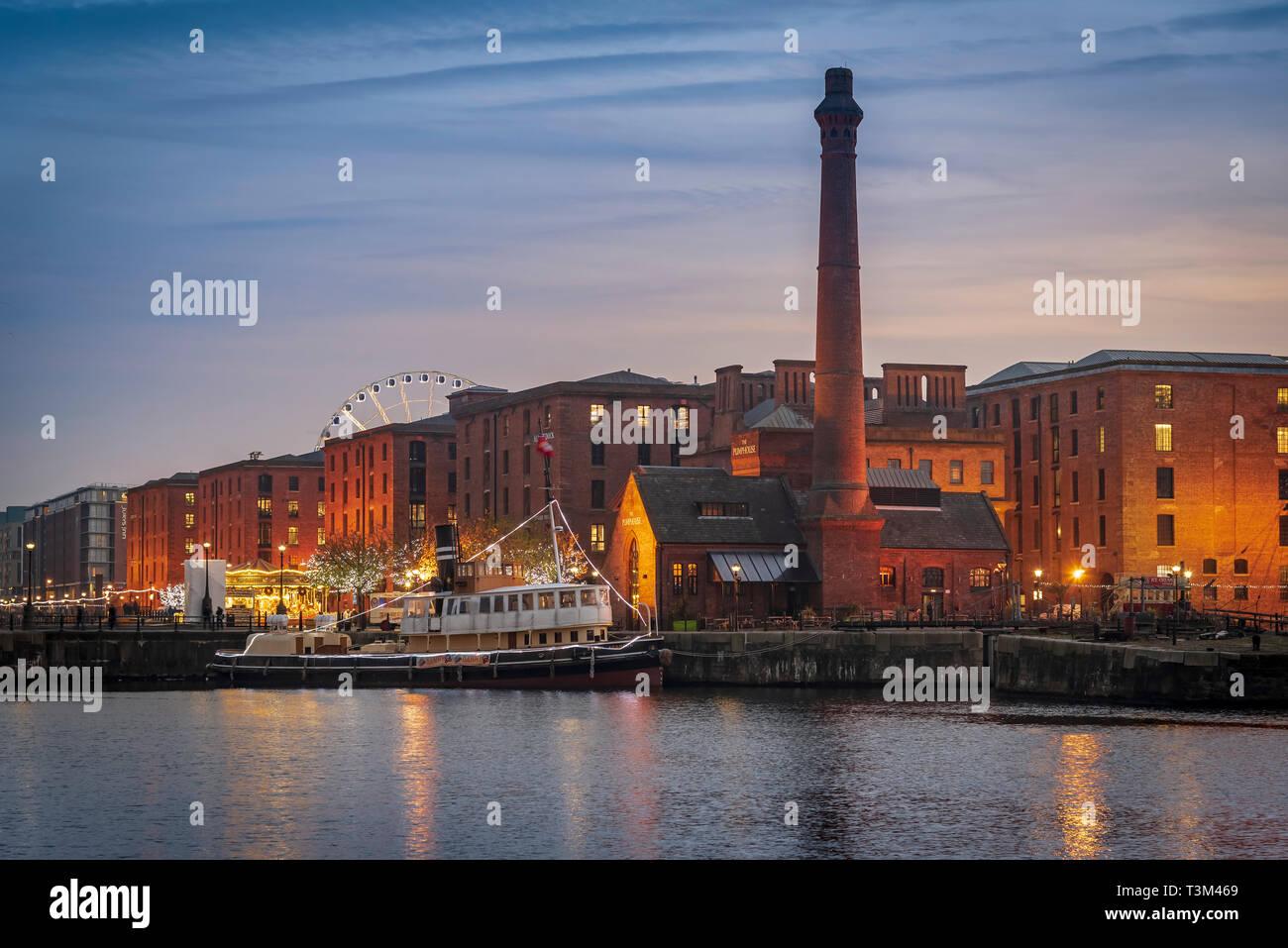 The Albert Dock complex buildings in the evening light with steam tug ...