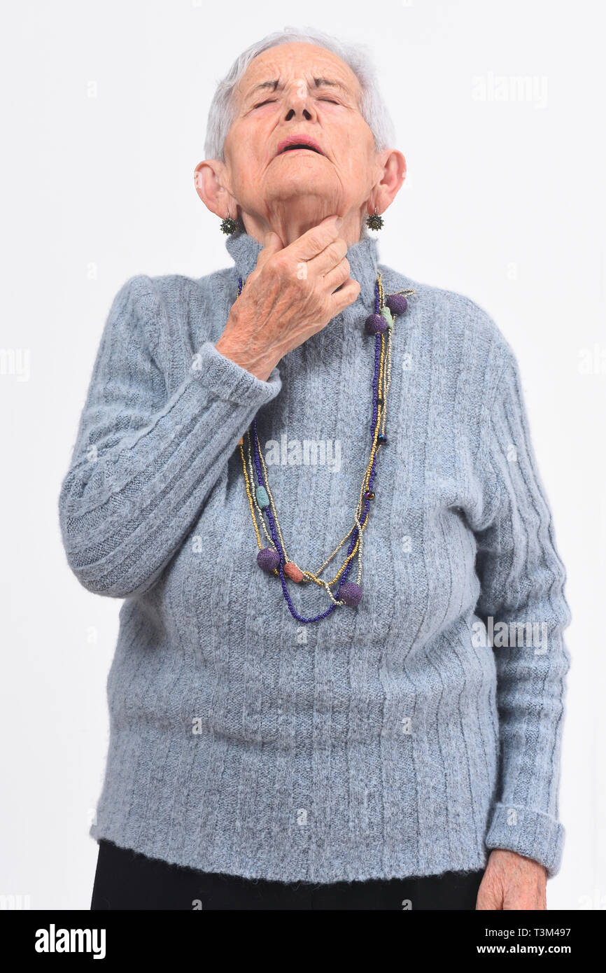 senior woman with pain in trachea white background Stock Photo - Alamy