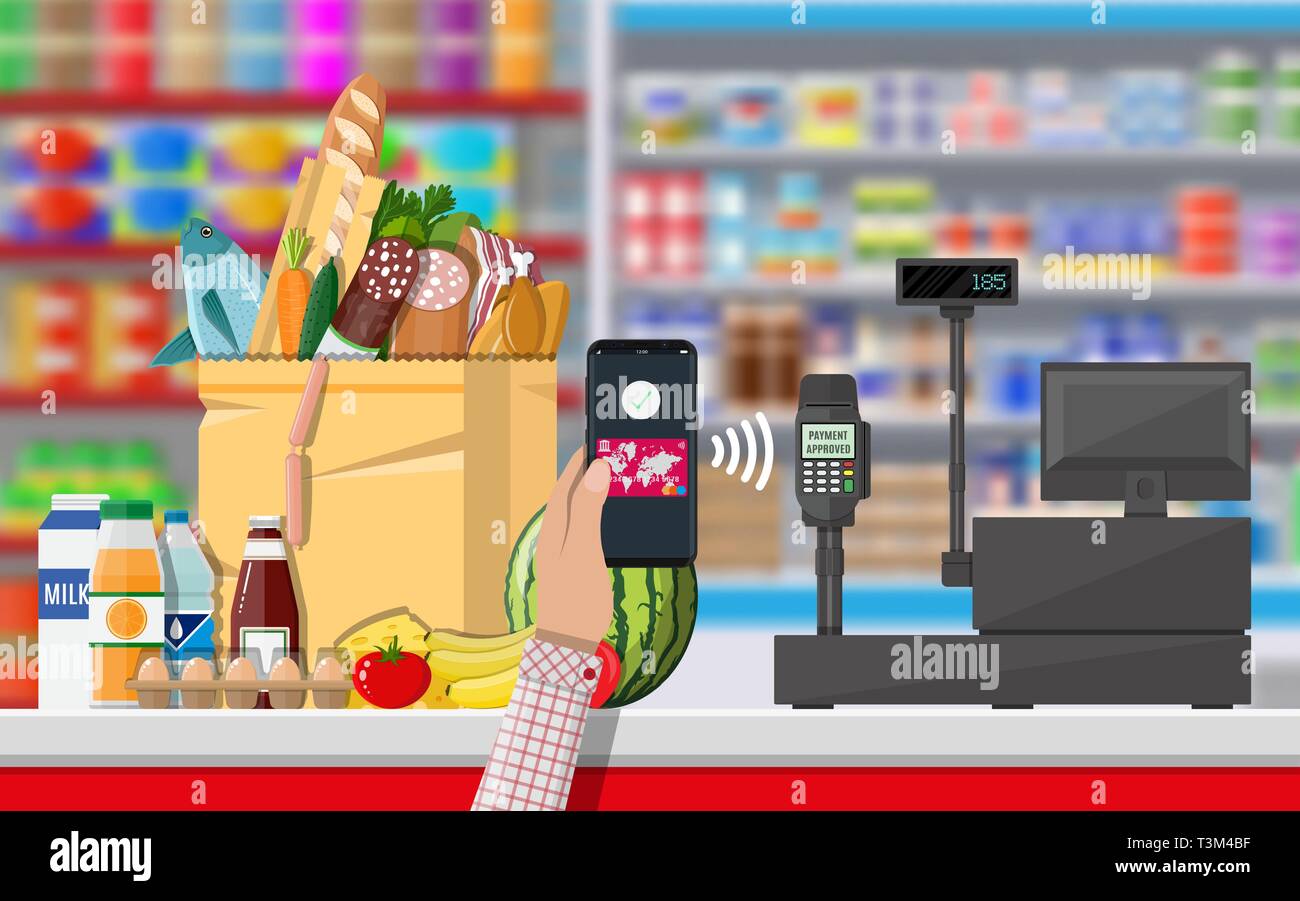 Pos terminal confirms payment by smartphone. Supermarket interior ...