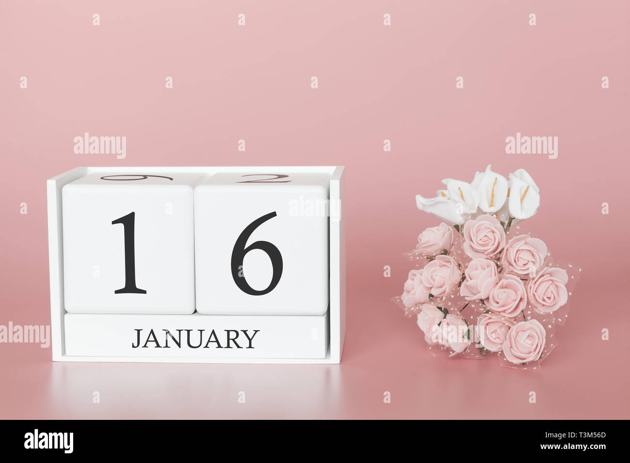 January 16th. Day 16 of month. Calendar cube on modern pink background ...