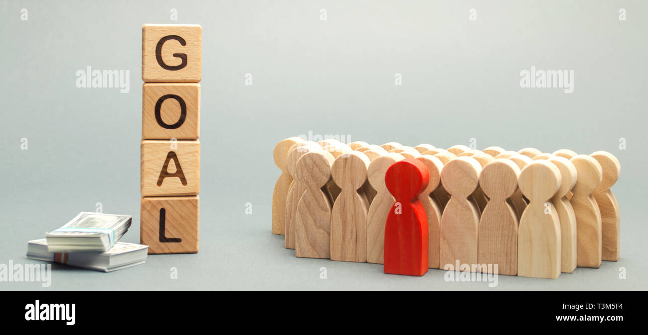 Wooden blocks with the word Goal, money and business team. Business ...