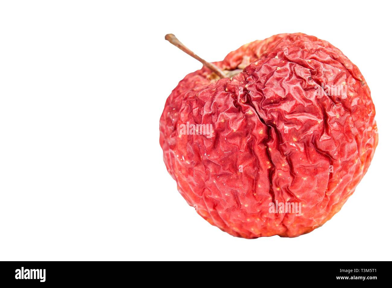 Wrinkled apple texture with white background. Shriveled apple. Old ...