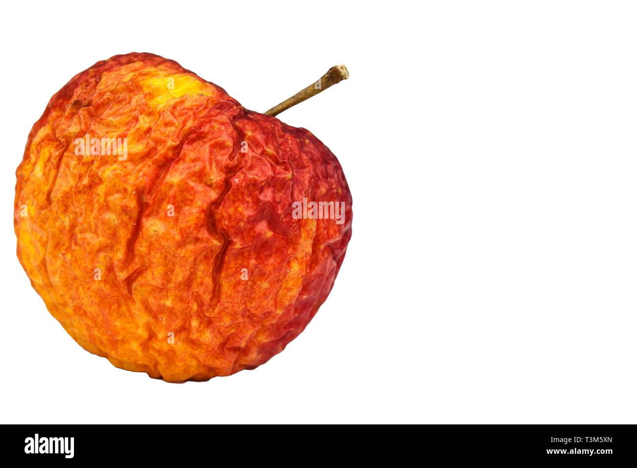 Wrinkled apple texture with white background. Shriveled apple. Old ...