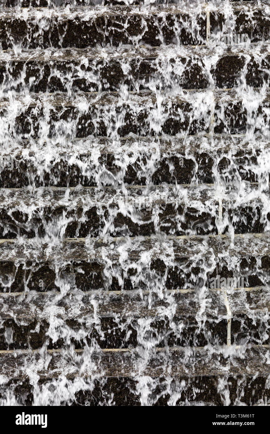 Horizontal steps with complex flowing, splashing water. Busy pattern ...