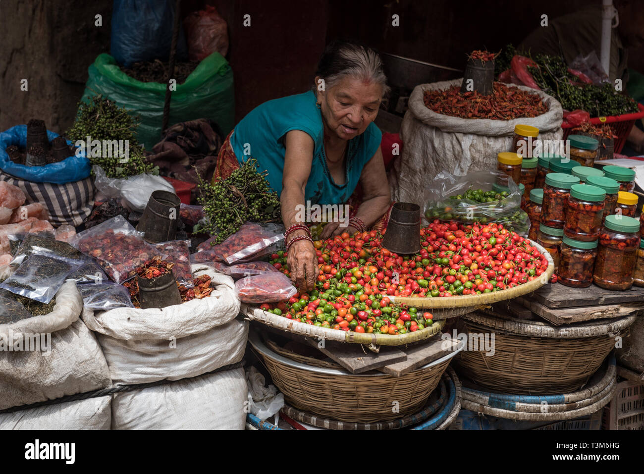 Old woman selling chillies and pickles, Ason Tol market, Kathmandu ...