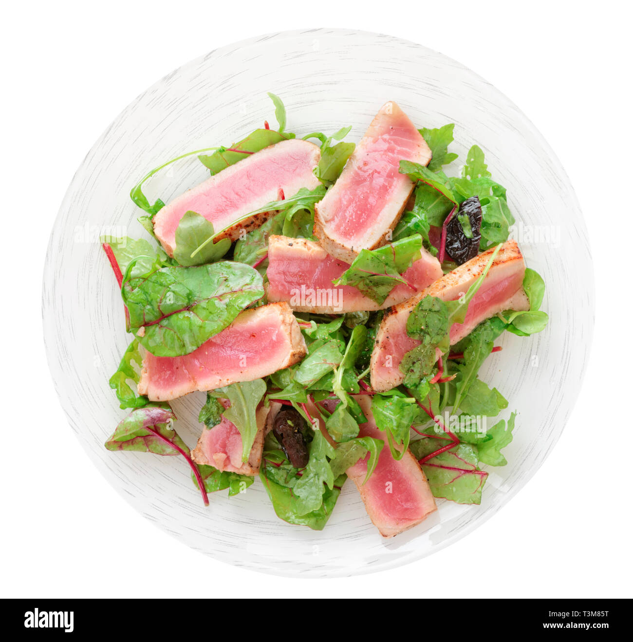 Appetizer with rare fried tuna in plate isolated on white background ...